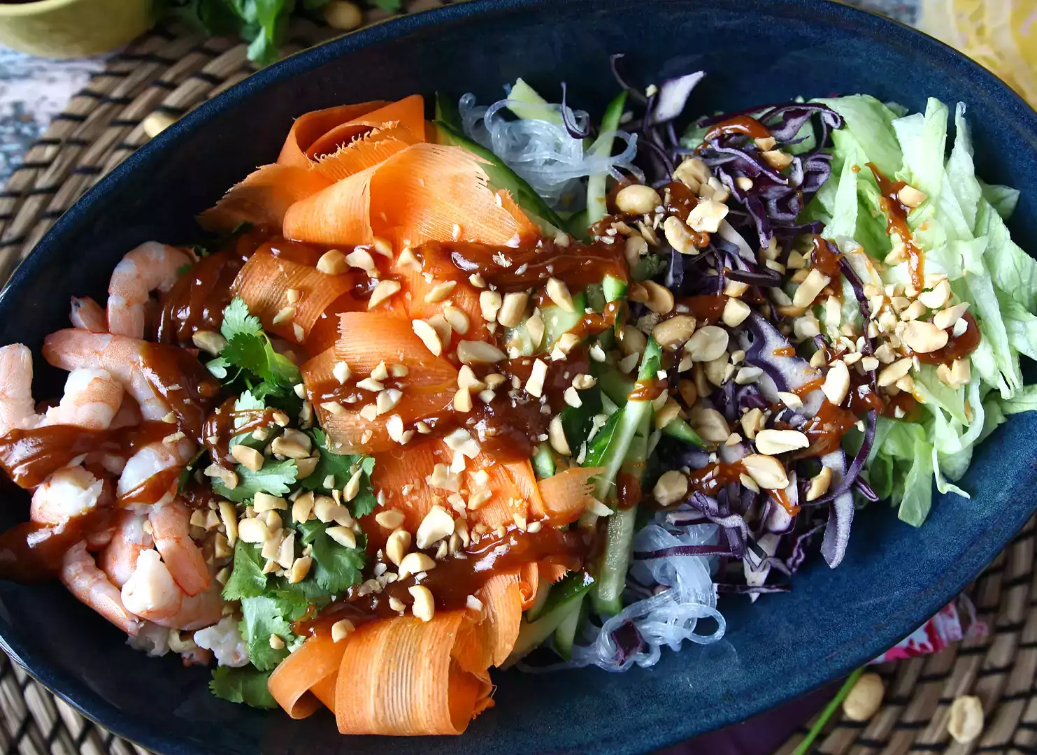 Colourful spring roll salad with rice vermicelli, shrimp and a peanut sauce