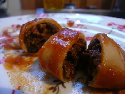 Tasty tapas: chorizo and parsley stuffed baby squid, poached in roasted ...